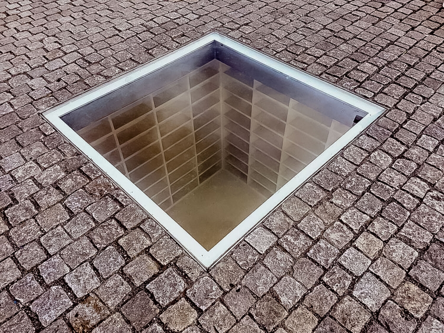 Bebelplatz book burning memorial with its empty library by Thomas ...